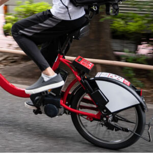 Riding electrically power-assisted bicycles (e-bikes) in central Tokyo ...